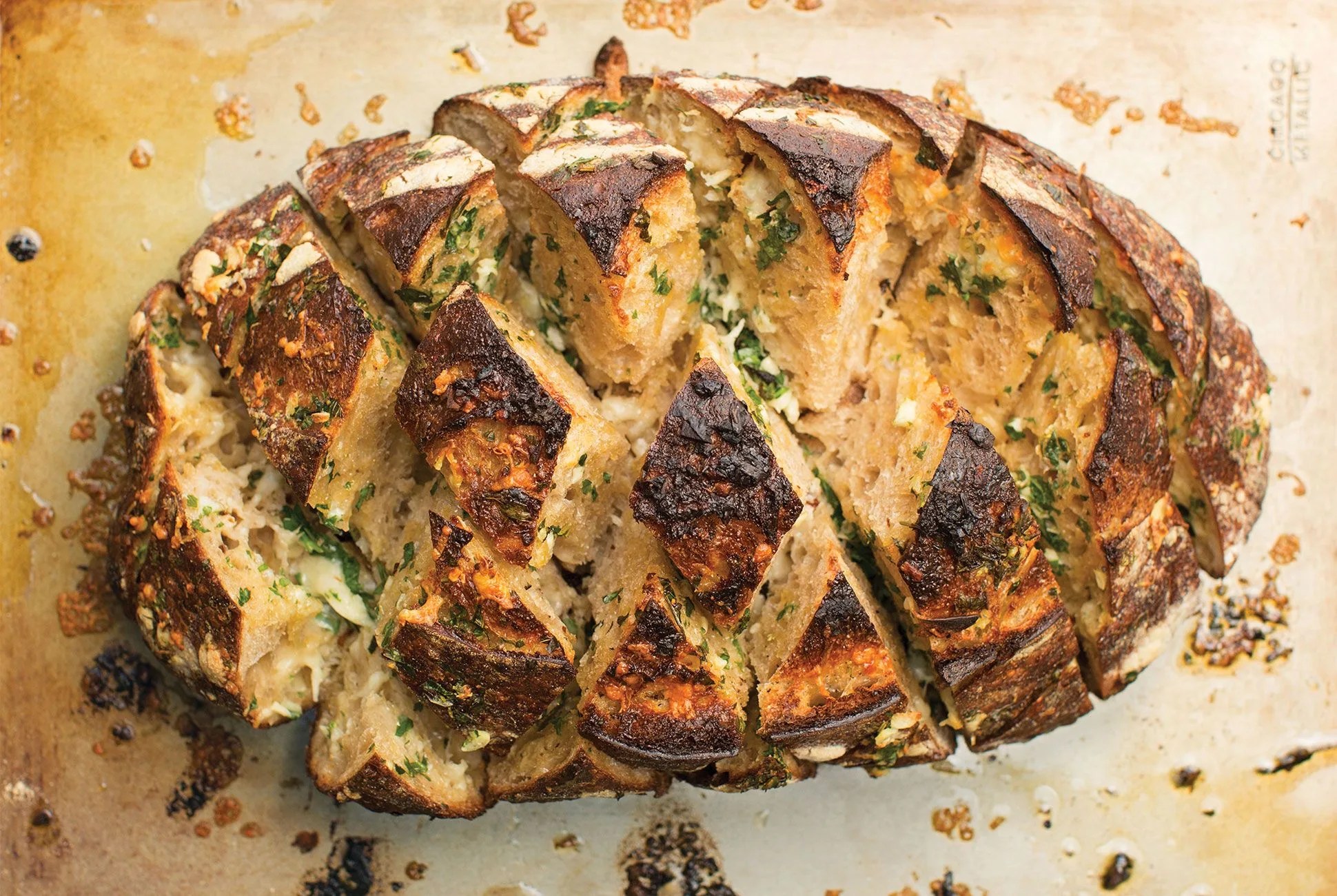 For Better Garlic Bread, Add Cheese and Use the Entire Loaf | Gear Patrol