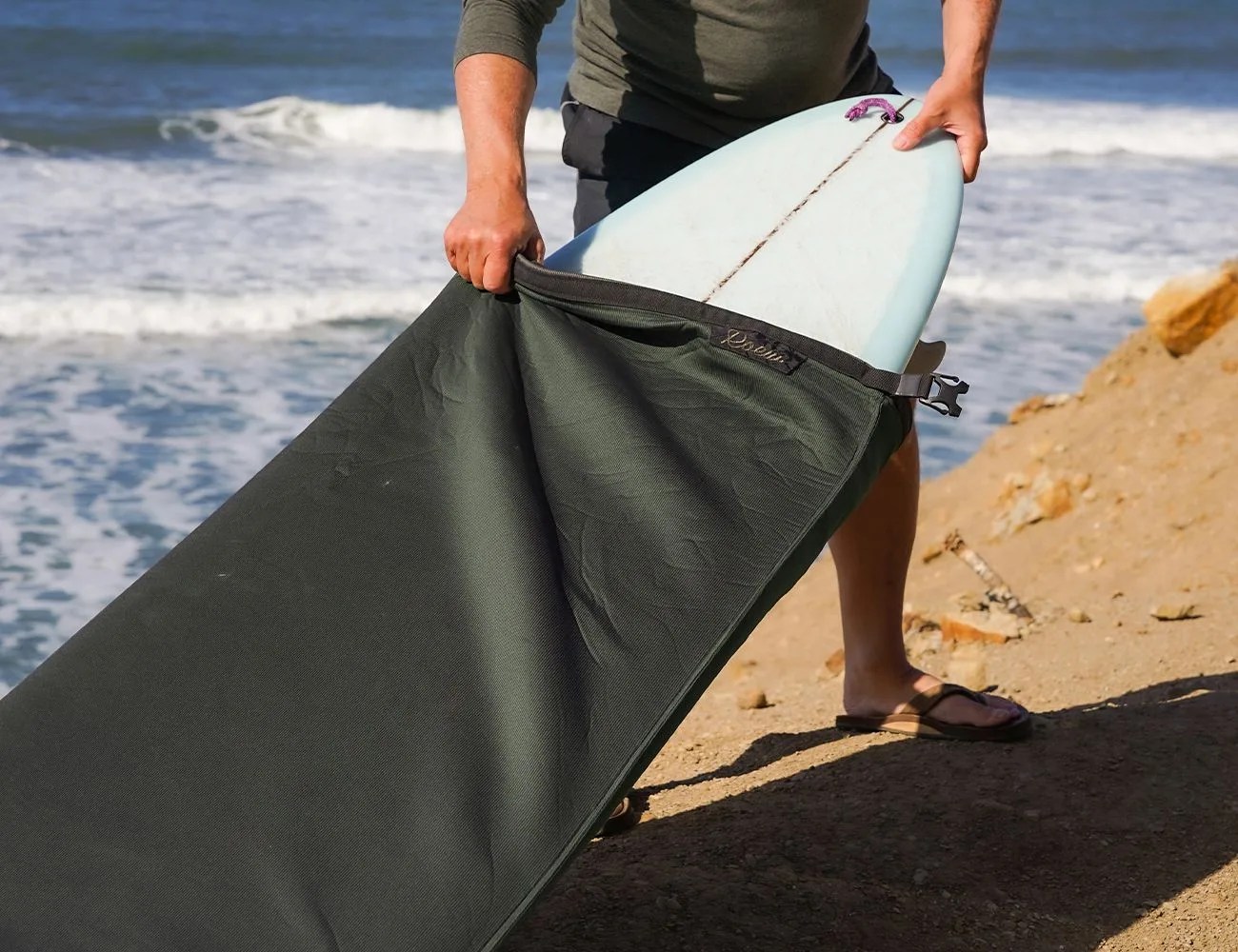 This New Surfboard Bag Boasts a Shockingly Intuitive Feature | Gear Patrol