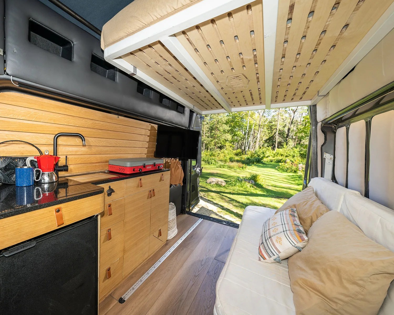 This Clever Camper Van Sleeps Way More People Than the Footprint ...